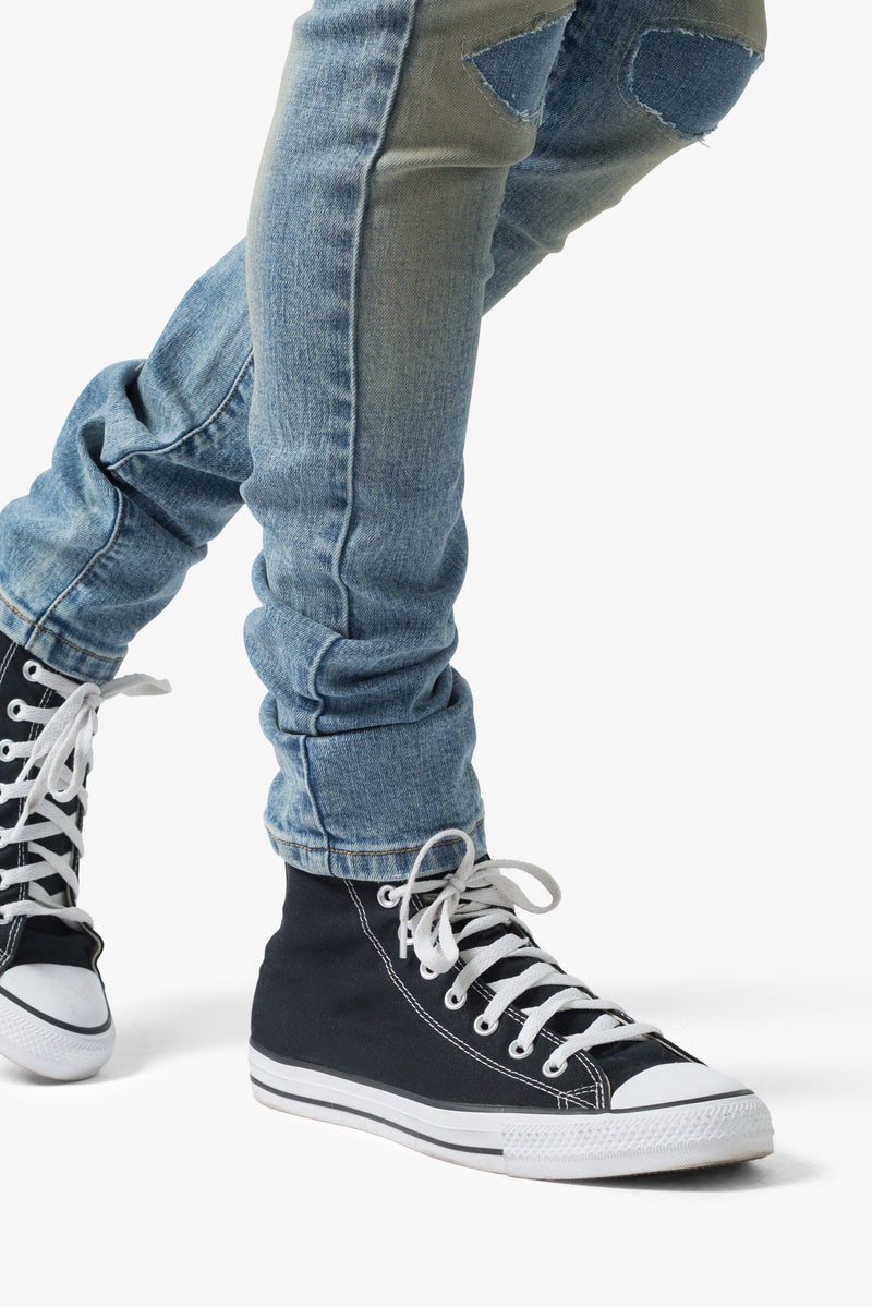 X651 Distressed Circle Knee Denim - Blue | mnml | shop now